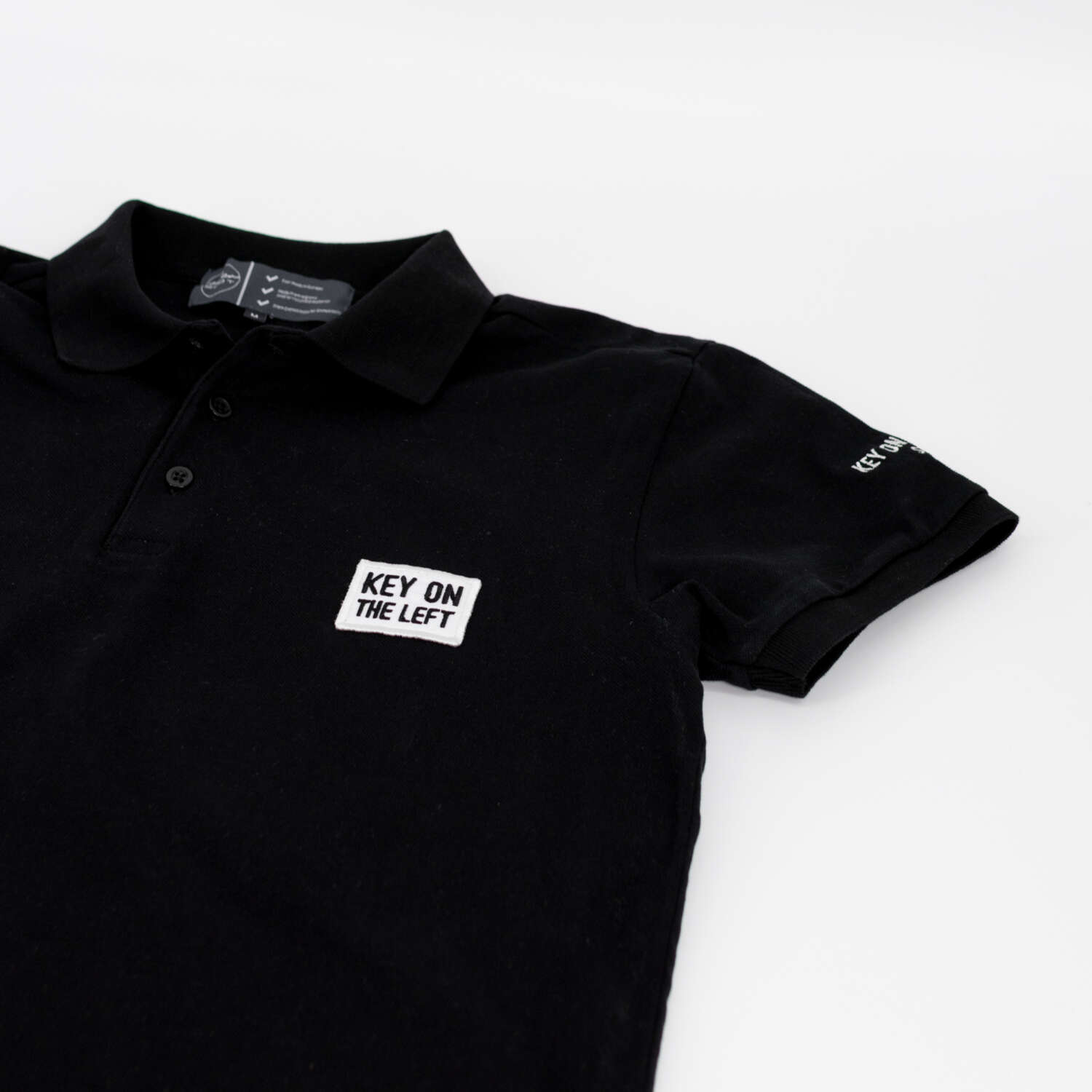 Polo Shirt Key on the left Schwarz - Driver's Collection - Elferspot Shop